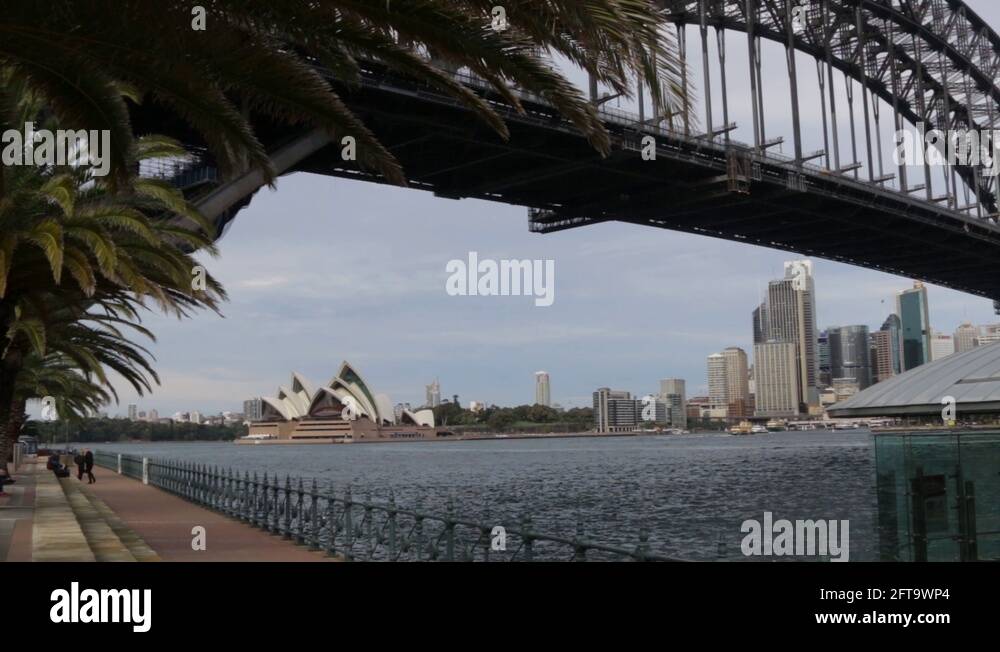 Sydney Opera House behind harbour Bridge Stock Video Footage - Alamy