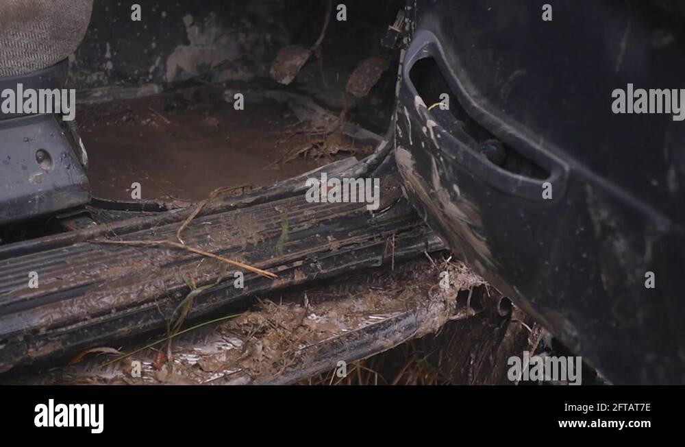 Very dirty interior of the car inside, with puddles and grass. HD Stock ...