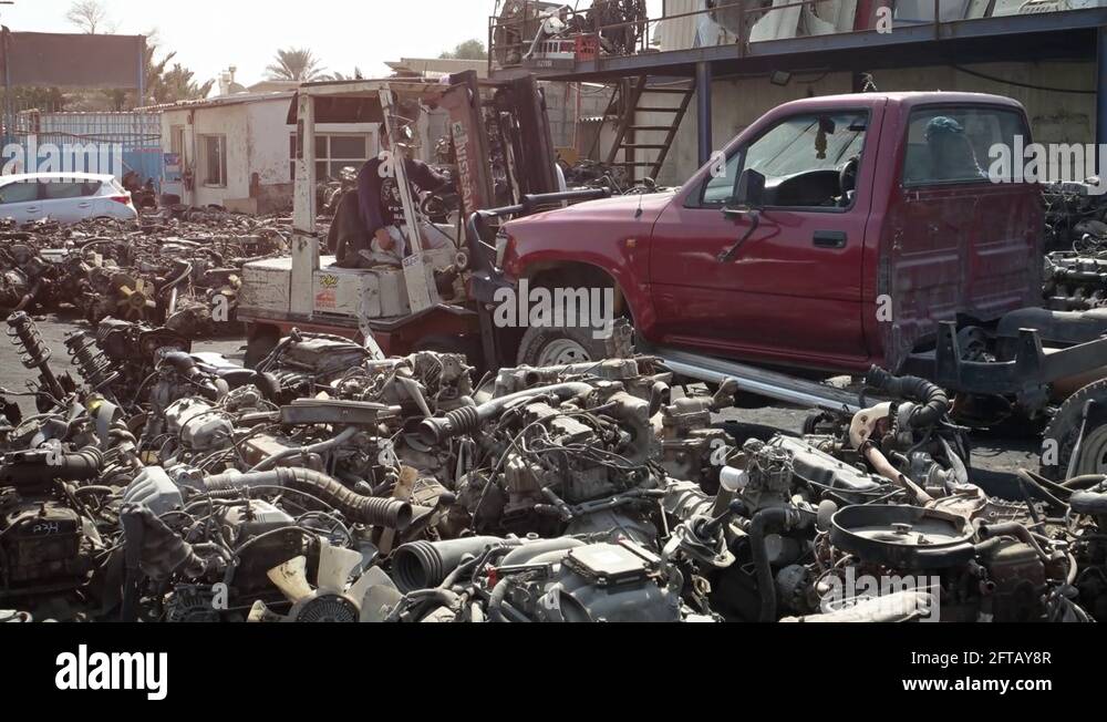 Forklift Towing Old Truck Cab and Chassis at Local Junkyard Stock Video ...