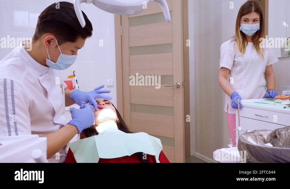 Anaesthetic injection in the gum of the upper syringe in the dentist ...