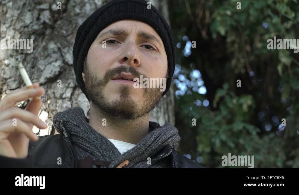 Smoking under a tree Stock Videos & Footage - HD and 4K Video Clips - Alamy