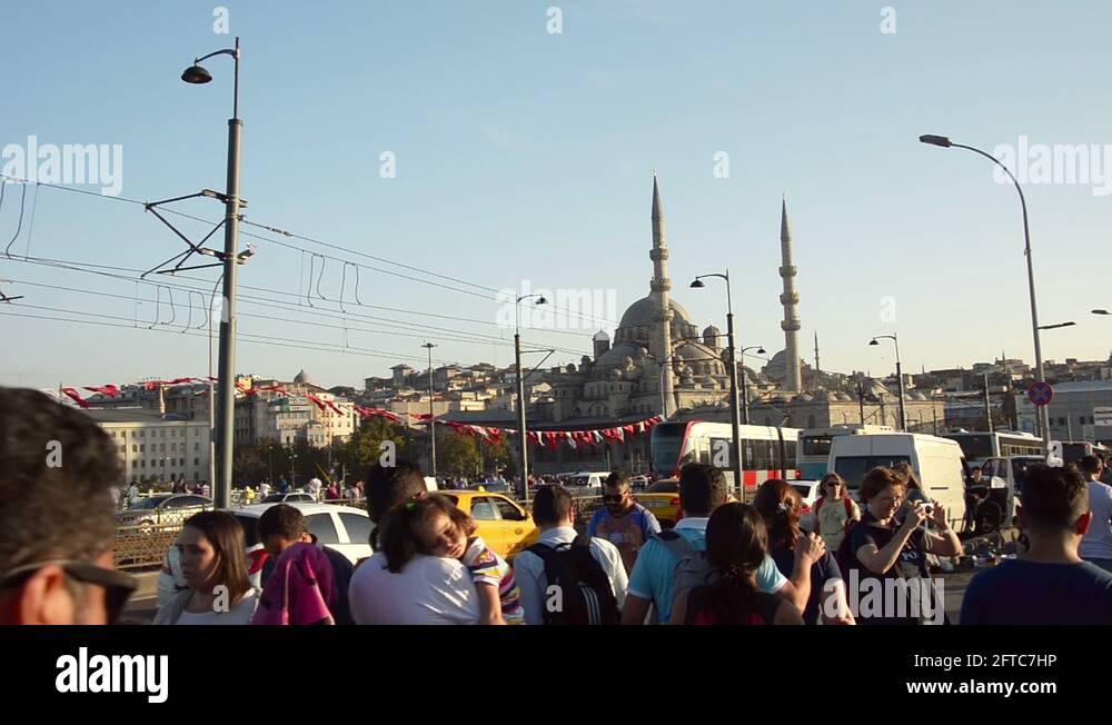 Shot of daily life at Istanbul's old downtown, tram, car traffic, walk ...
