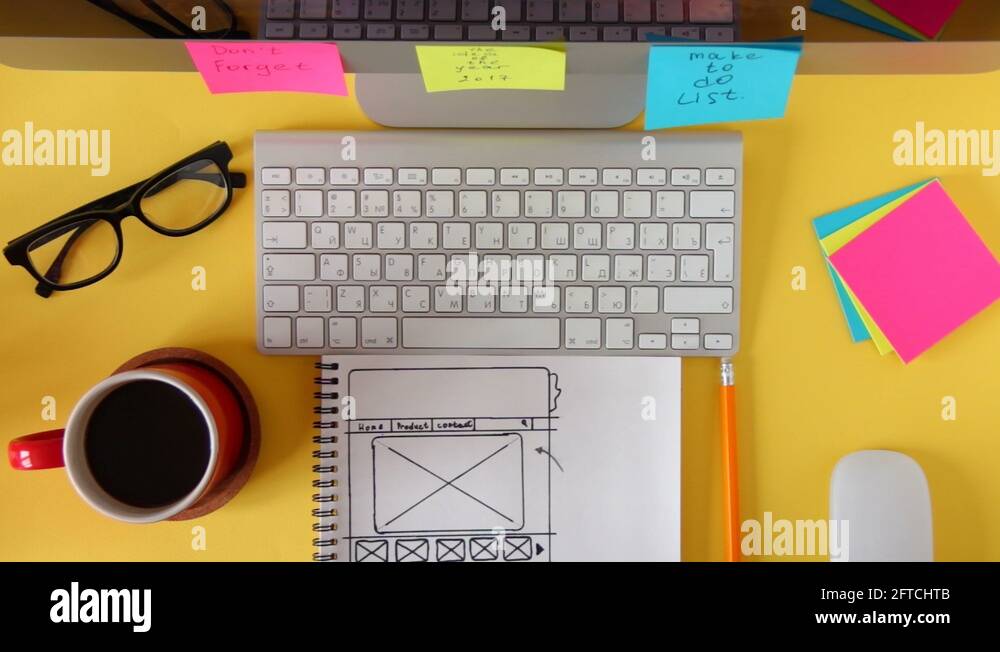 Webmaster draws the future layout of the web pages in the sketch book ...