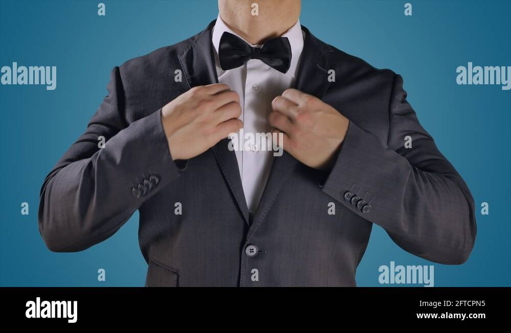 4K Hands Fixing Black Bow Tie, Blue Background, Ceremony Black Suit ... 4K Hands Fixing Black Bow Tie, Blue Background, Ceremony Black Suit ...