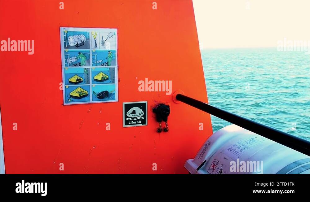 Sticker with instructions on tug deck. Life raft with manual inflatable ...