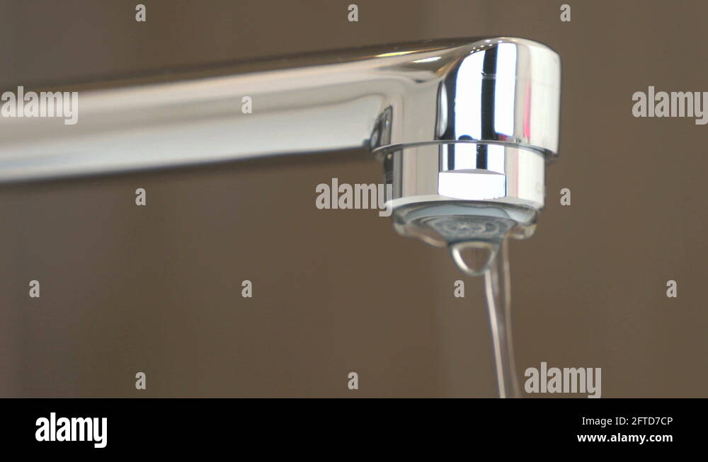 Water weak pressure flows from a water tap Stock Video Footage - Alamy