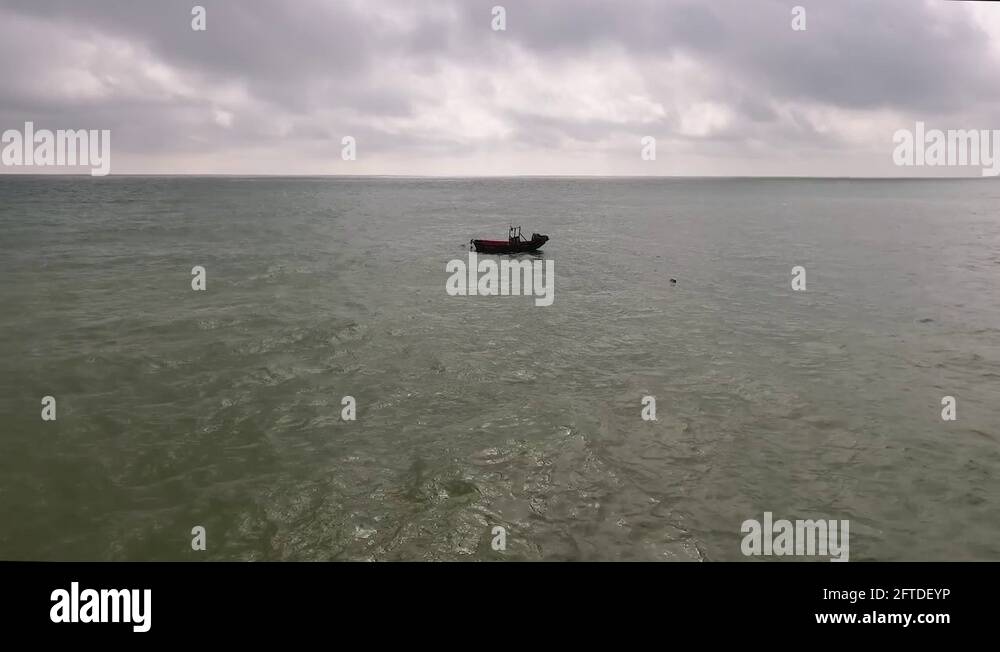 Lonely boat rocking on the waves Stock Video Footage - Alamy