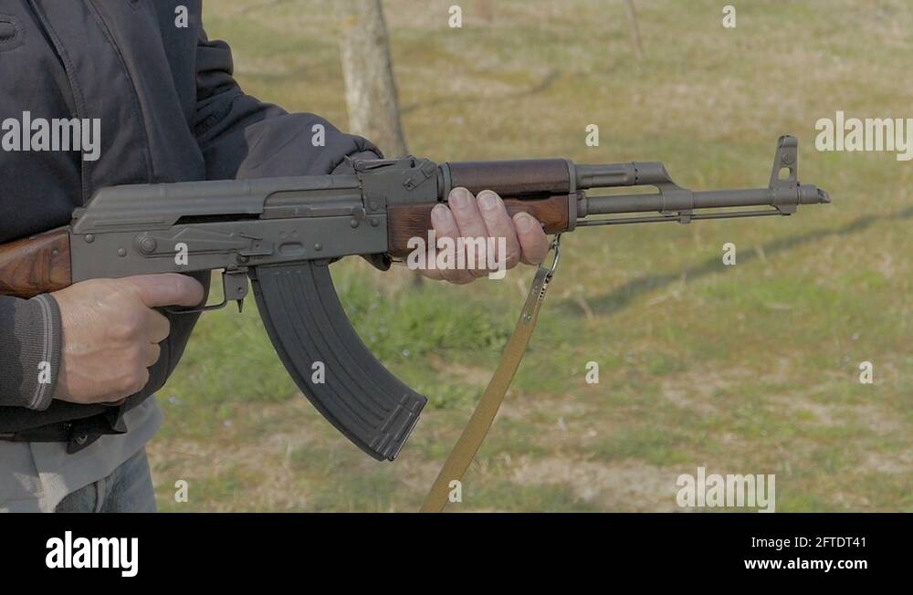 Firing an assault rifle AK-47 Kalashnikov, slow motion Stock Video ...