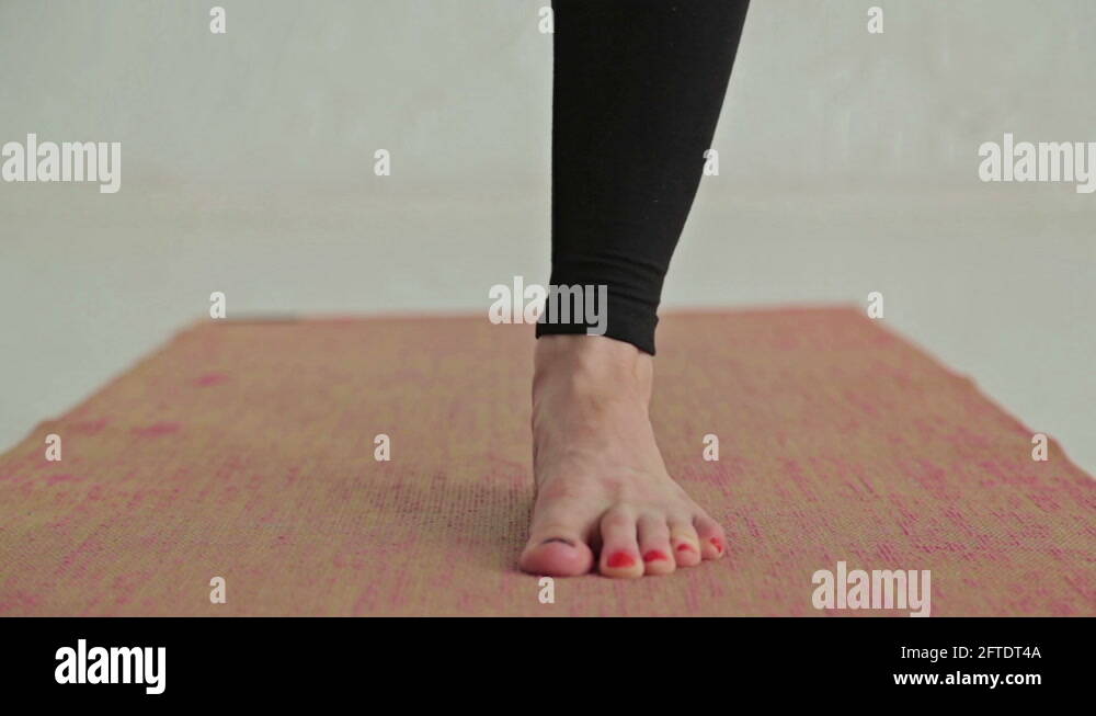 Woman practicing yoga - ardha baddha padma padangusthasana - balancing ...