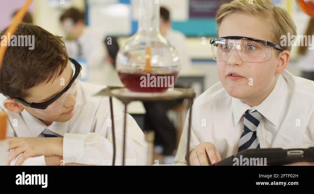4k, A very excited boy doing a science experiment Stock Video Footage ...