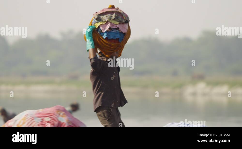 Dhobi Ghat (laundry by hand) using the Yamuna to wash traditional ...
