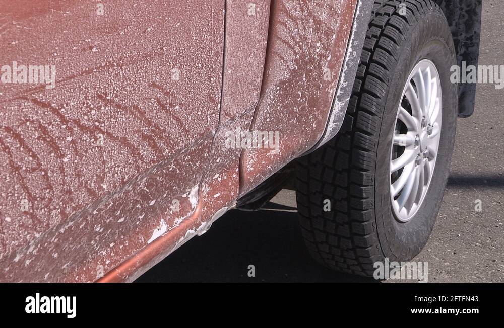 Road salt on vehicle causing rust and corrosion and paint damage Stock ...