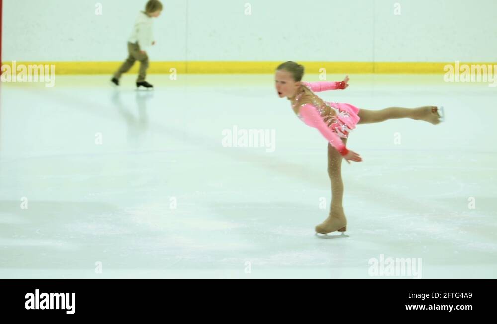 Little girl figure skating at the indoor ice arena Stock Video Footage ...