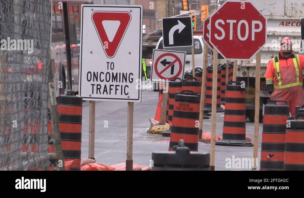 Road construction and traffic signs in downtown city streets Stock ...