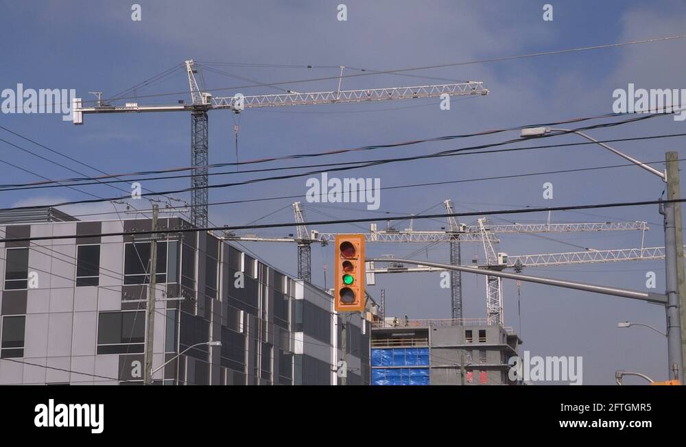 Construction cranes urban development Stock Videos & Footage - HD and ...