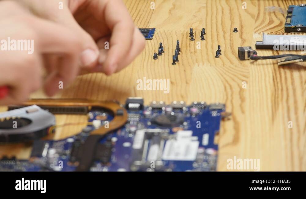 Laptop disassembling in repair shop, close-up. Disassembled computer motherboard Stock Video ...