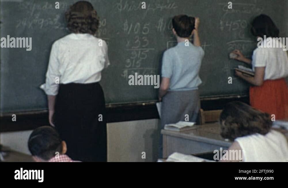 Teenage Girls Students Write Blackboard Math Class 1950s Vintage Film ...