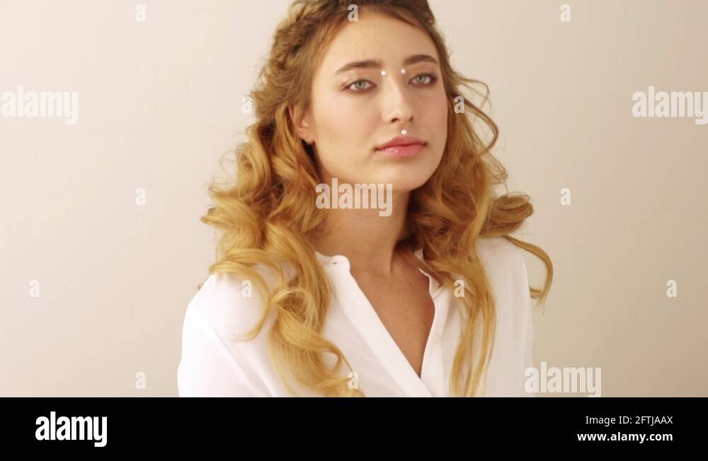 The beautiful girl poses model in image in a photographic studio for ...
