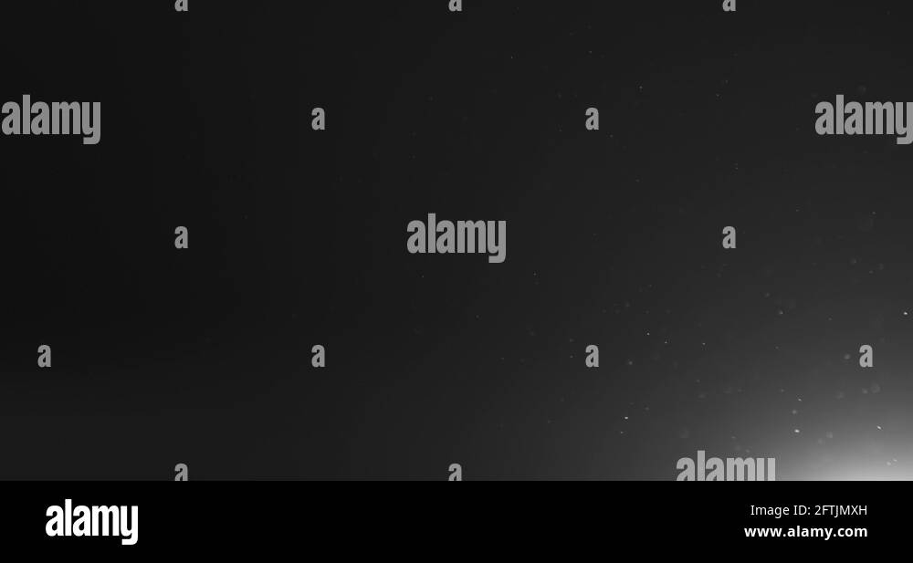 dust particles explosion from right with light leak loopable Stock ...