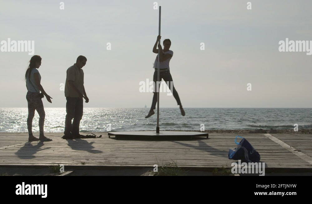 Pole dance fitness exercise on the beach Portable spinning pole kit ...