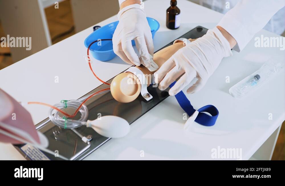 Student preparing arm model for injection Stock Video Footage - Alamy