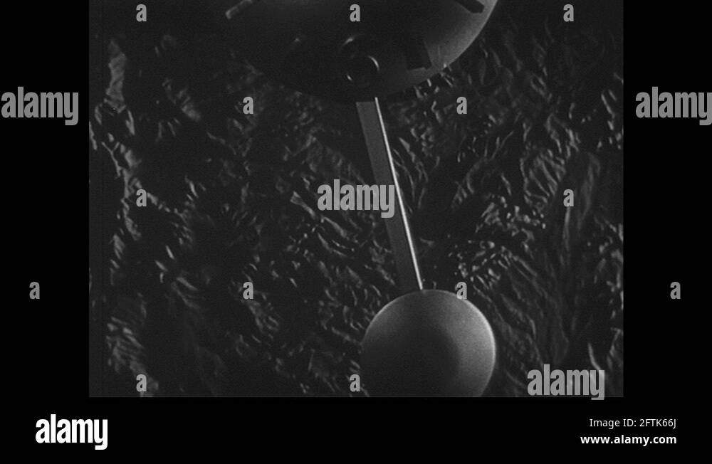 1950s:Fade from black to a bell tolling. Clock pendulum swings. Tilt up ...