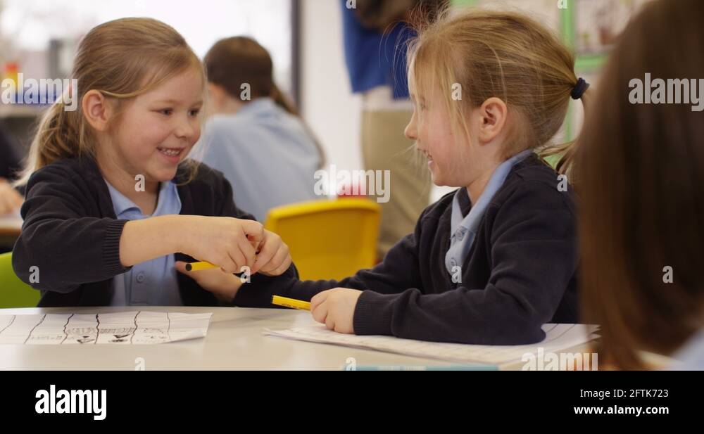 4k, two playful little girls in a classroom. Slow motion Stock Video ...