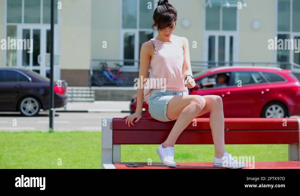 Girl poses on bench Stock Videos & Footage - HD and 4K Video Clips - Alamy