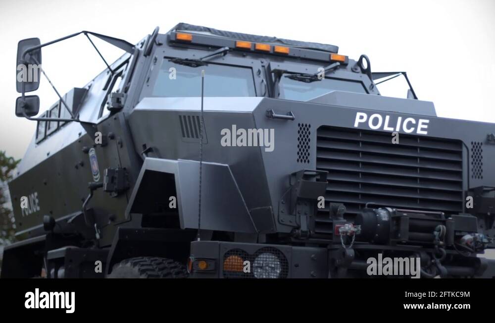 Armored SWAT vehicle sitting in police station parking lot - Close up ...