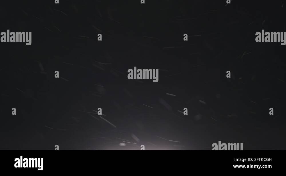 Slow motion of dust particles fly in the air with light leak from below ...