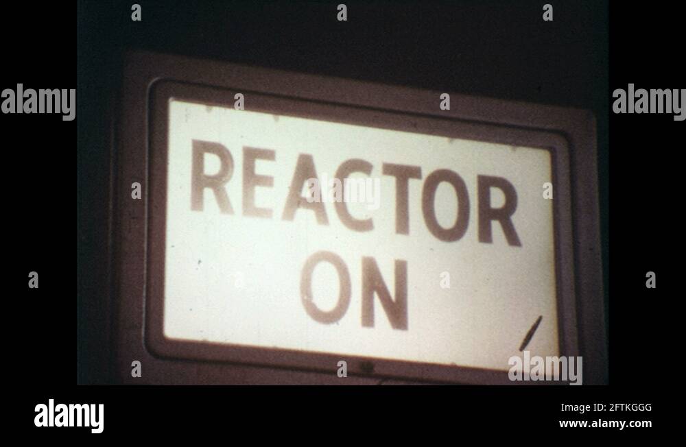 1960s: Illuminated 'Reactor On' sign / Close up of worker / Hand ...