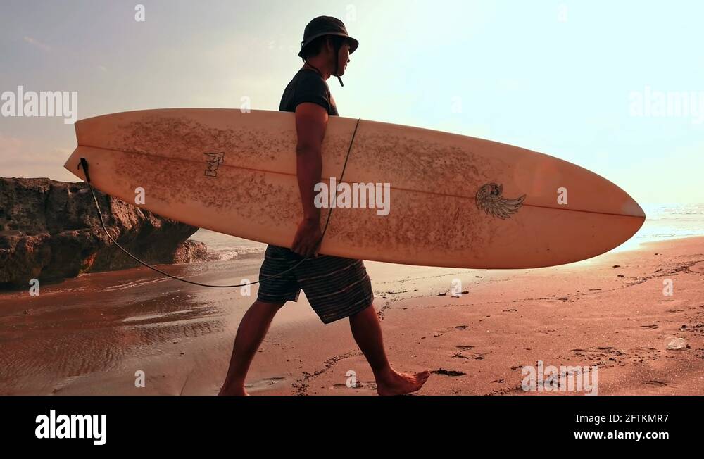 Walking on sand carrying surfboard Stock Videos & Footage - HD and 4K ...