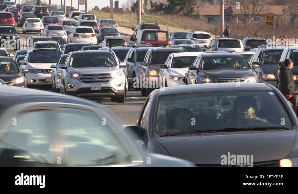 Heavy rush hour traffic jam and gridlock in city streets and ...