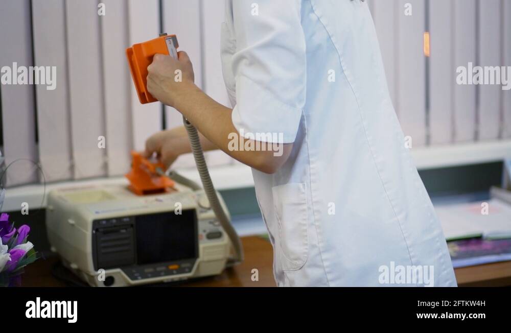 Nurse puts electroconvulsive shock probes back to device in hospital ...