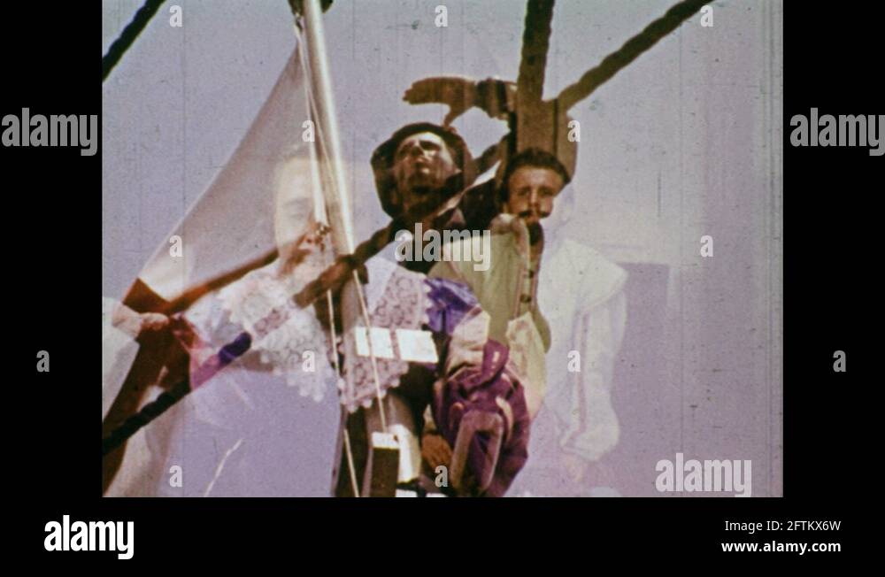 1950s: Dissolve, colonial man on ship flag pole / Colonist on ship ...