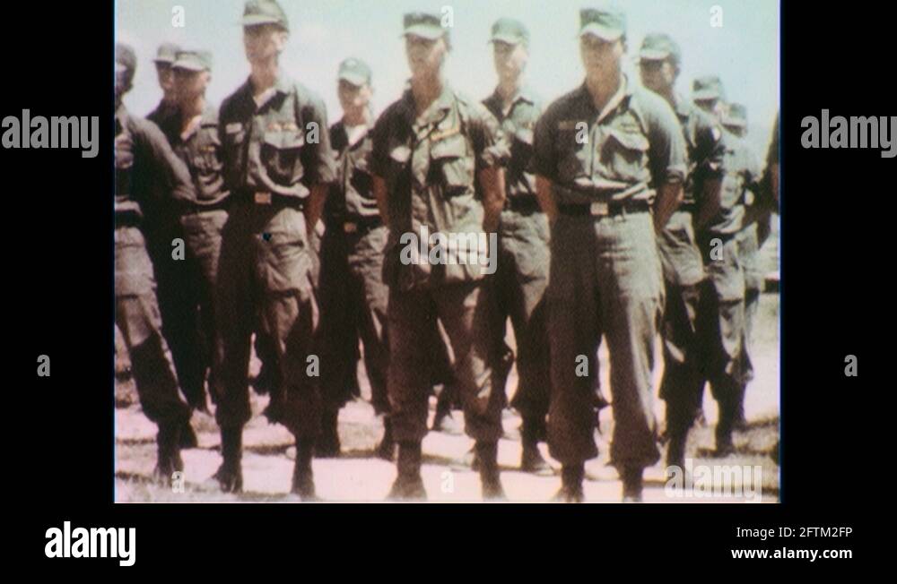 1960s: Views of soldiers standing at ease / Officer speaking, soldiers ...