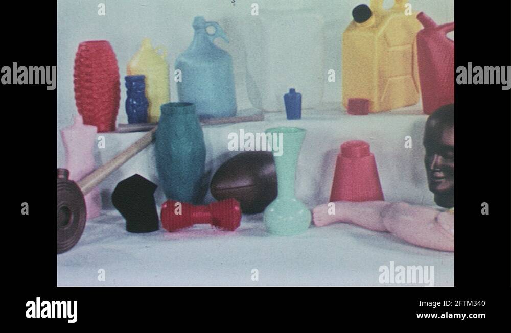 1950s: Display of plastic products, man adds products to display Stock ...