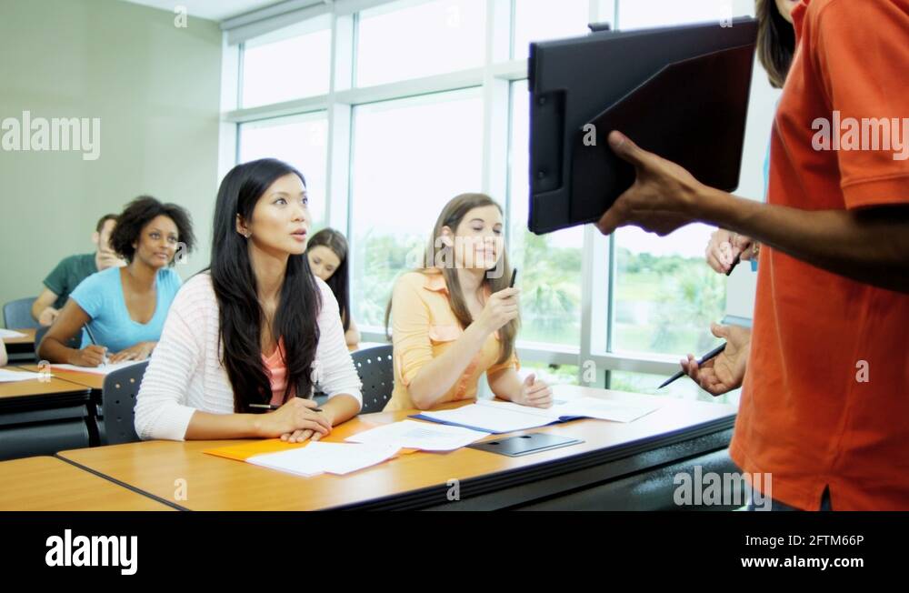 Teenage male Indian Asian college student giving classroom presentation ...