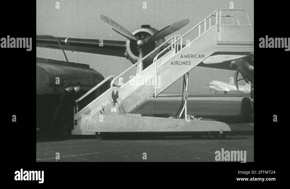 1940s – Workers roll ladder up to American Airlines plane. Pilot takes ...