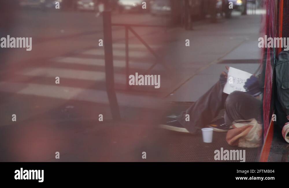 Homeless sitting Stock Videos & Footage - HD and 4K Video Clips - Alamy
