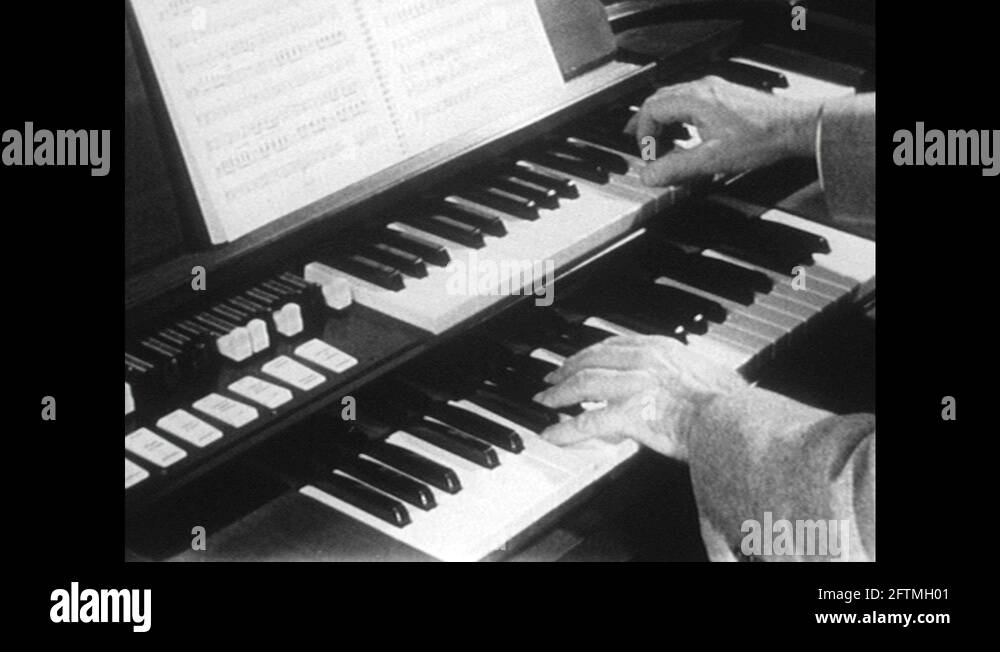 1950s : three young men demonstrate how they move the spinet organ from ...