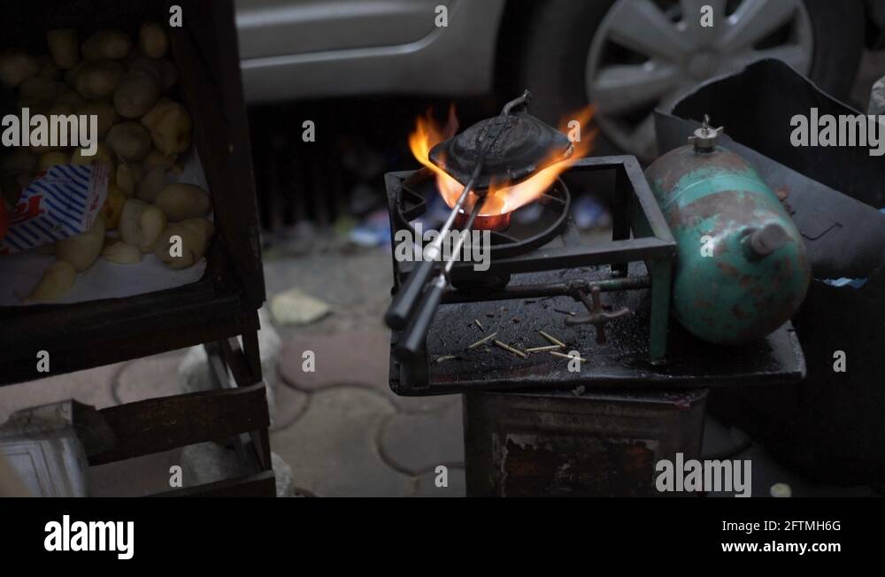Street food stall, bread toast on portable gas burner, Mumbai, India ...