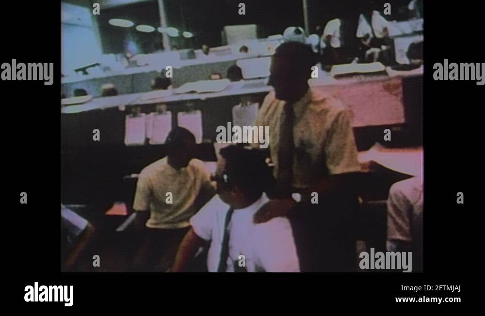 1970s: Men in NASA control room / Men at stations in control room ...