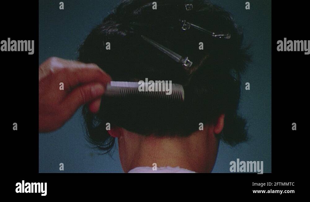 1960s: Back of woman's head, hands cut hair Stock Video Footage - Alamy