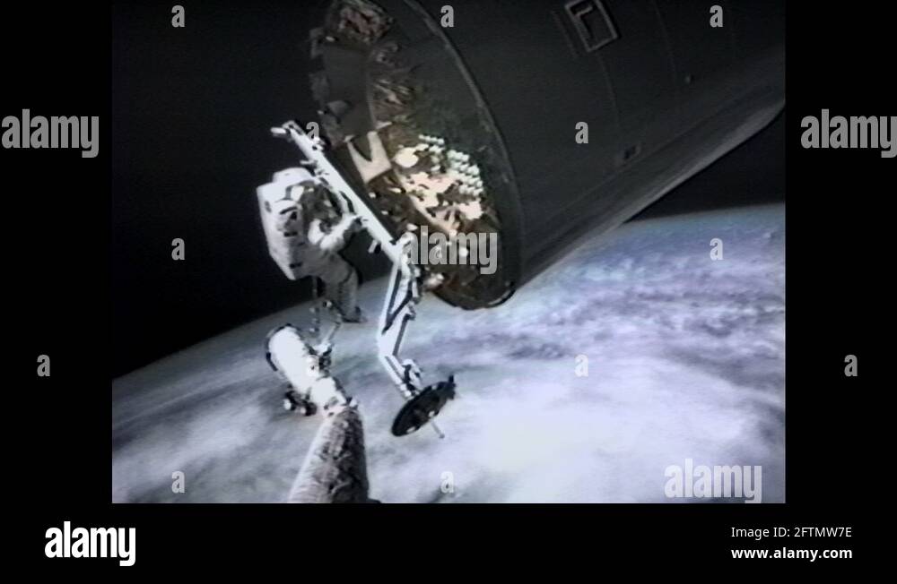 1990s: Robotic arm controllers maneuver astronaut, on STS-49 mission ...
