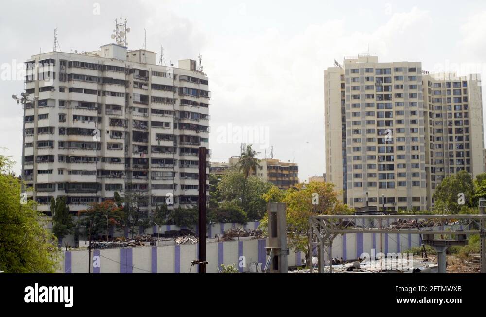 Crumbling crowded apartment buildings, poverty in Mumbai slums, India ...
