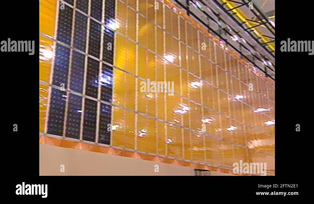 1990s: Large solar panel in a factory. CGI animation of sun eclipsing ...