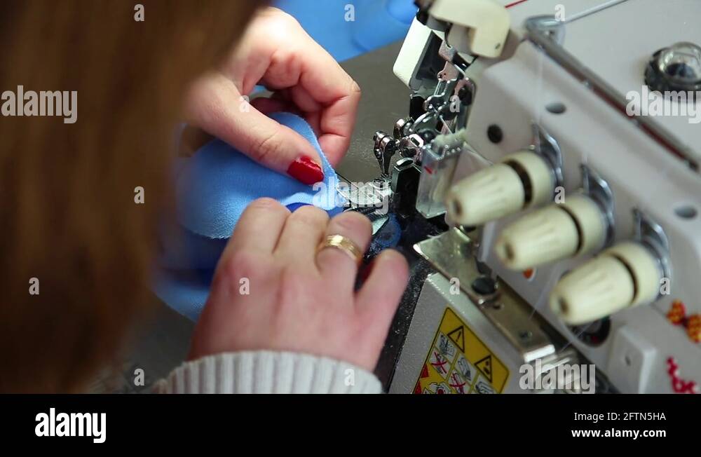 Sewer sews clothes on sewing Stock Videos & Footage - HD and 4K Video ...