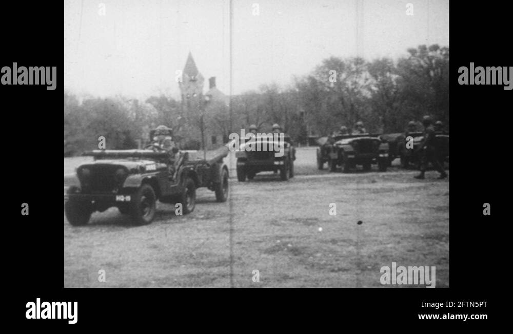 1960S: soldiers in armored vehicles. Rail Road Crossing sign at night ...