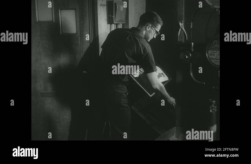 UNITED STATES 1960s: Man Loads Poster Original into Machine Ready for ...